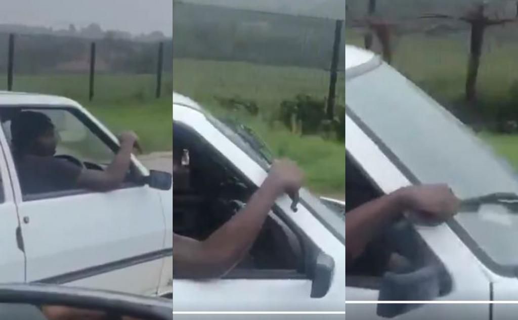 Rickety car driver uses his hand as manual wiper in heavy rain (Video ...