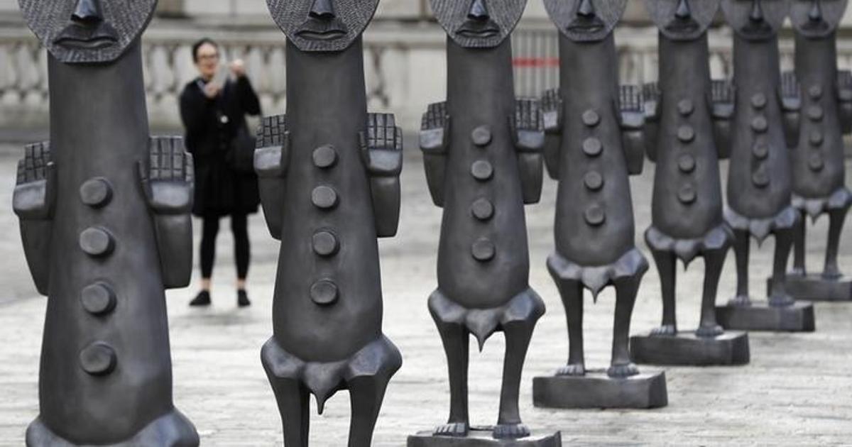 Army of black statues stands guard at African art show | Pulse Nigeria