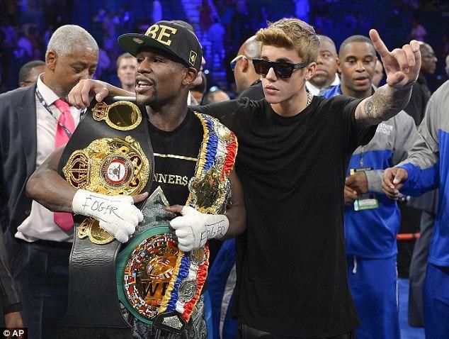 Justin Bieber set to carry boxer's championship belts into the ring for ...