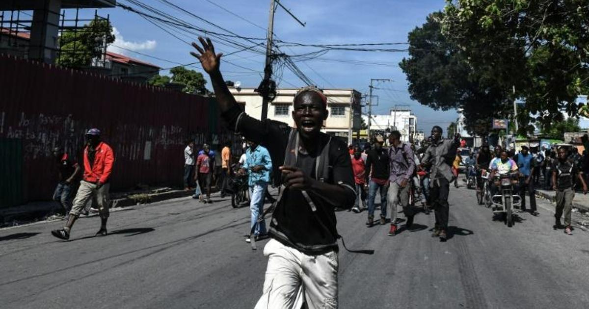 Haiti senator opens fire outside parliament, wounds photographer ...