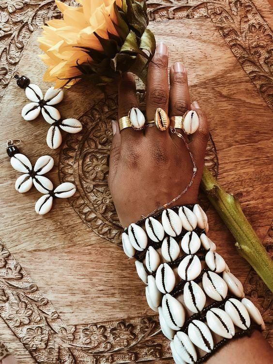 The origin story of cowrie shells, their significance and symbolism ...