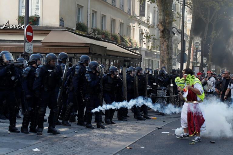Off-duty police captain among 158 held after Paris protests ...