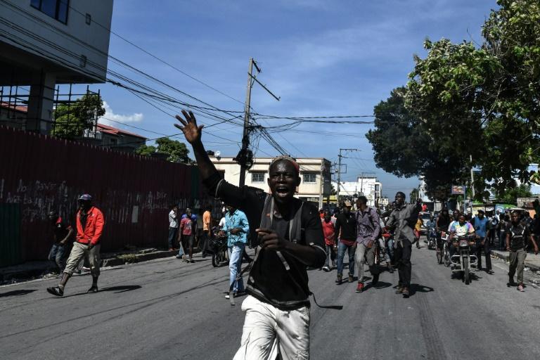 Haiti senator opens fire outside parliament, wounds photographer ...
